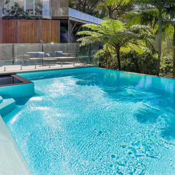 Infinity edge swimming pool with spa and cabana in Mosman