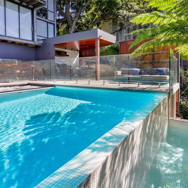 Infinity edge swimming pool with spa and cabana in Mosman