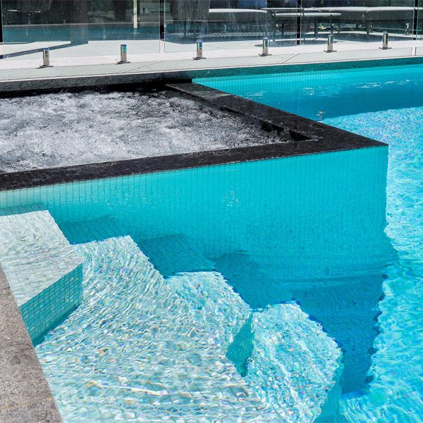 Infinity edge swimming pool with spa and cabana in Mosman